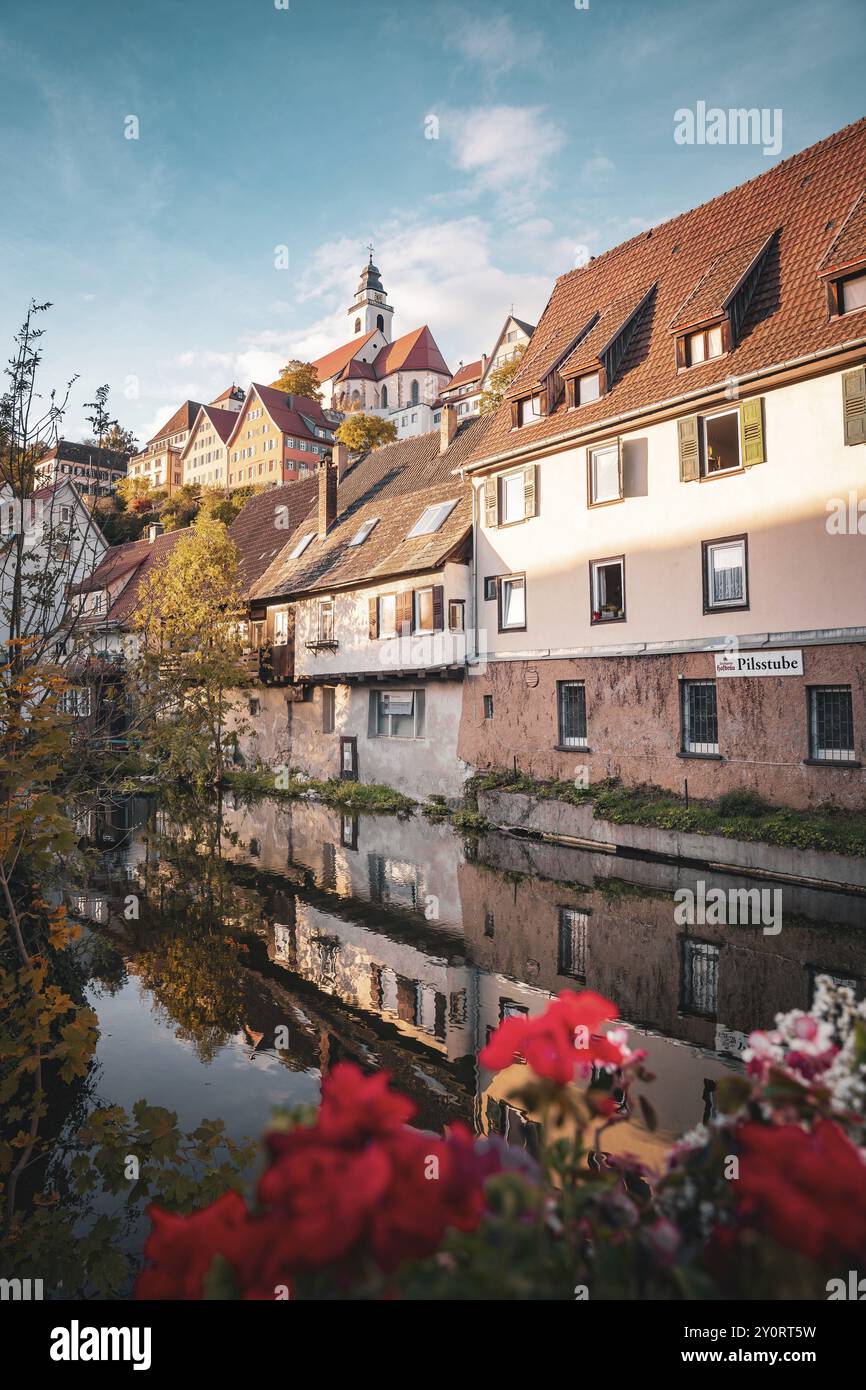 Old town with river and reflections of the historic buildings in the ...