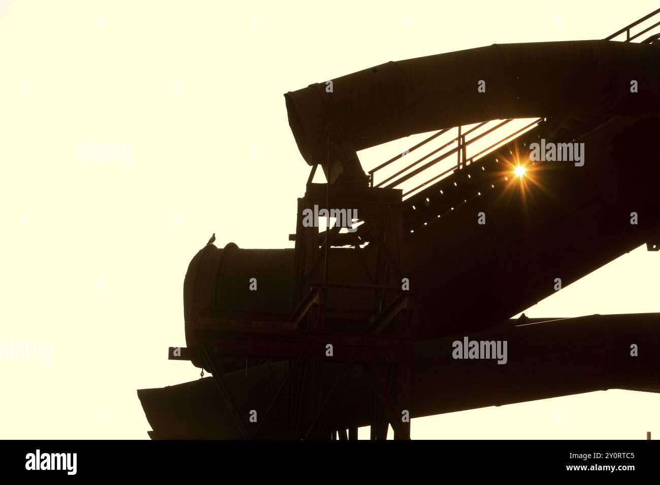 The sun shines through large former industrial pipes in the Westpark ...