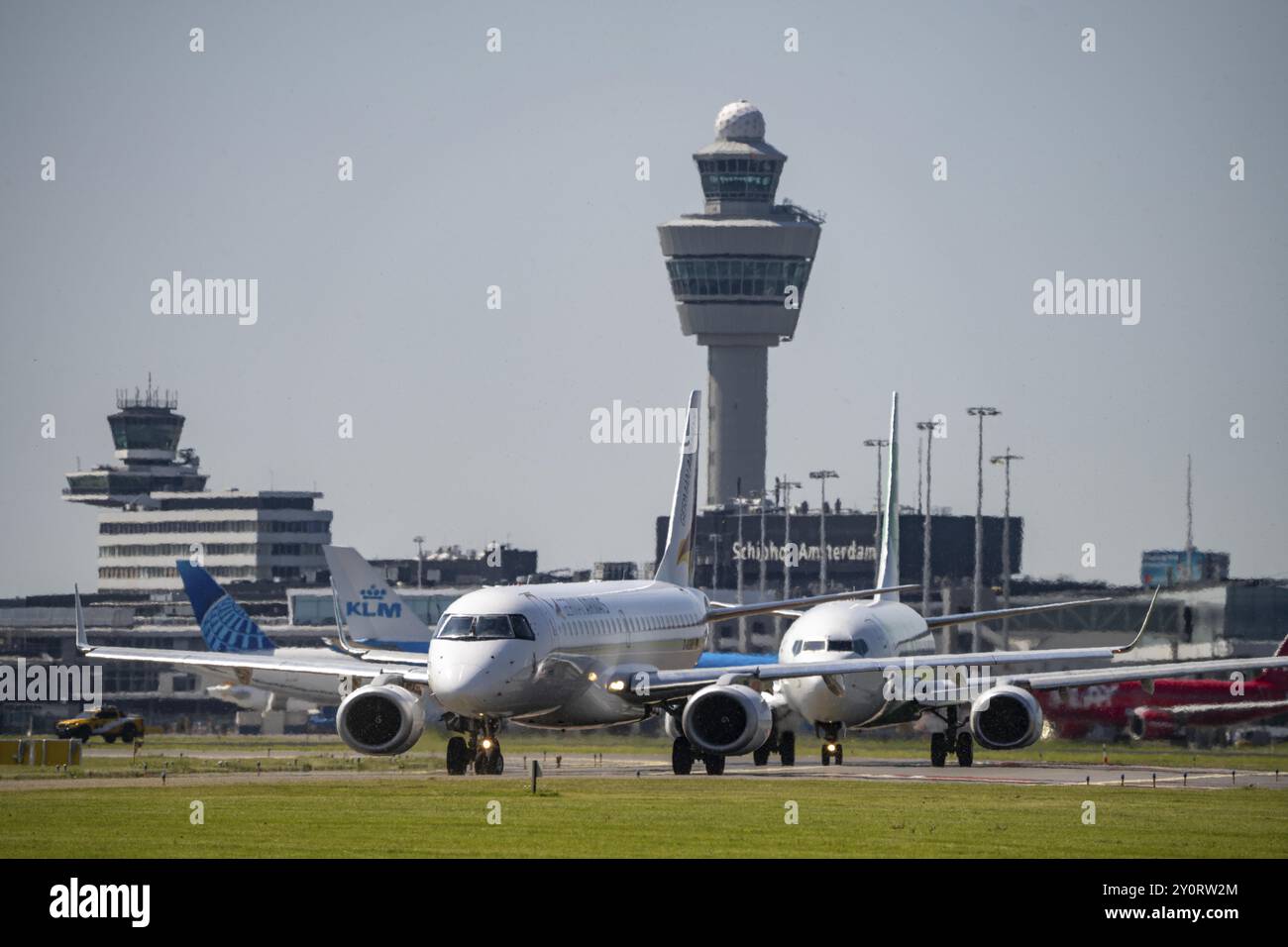 Aircraft at Amsterdam Schiphol Airport, on the taxiway for take-off on ...
