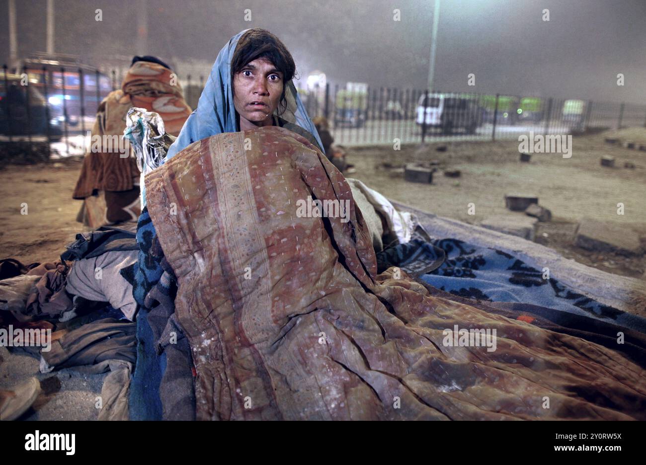 New Delhi, India, 21.01.2010, Homeless woman. Sleeping place under a ...