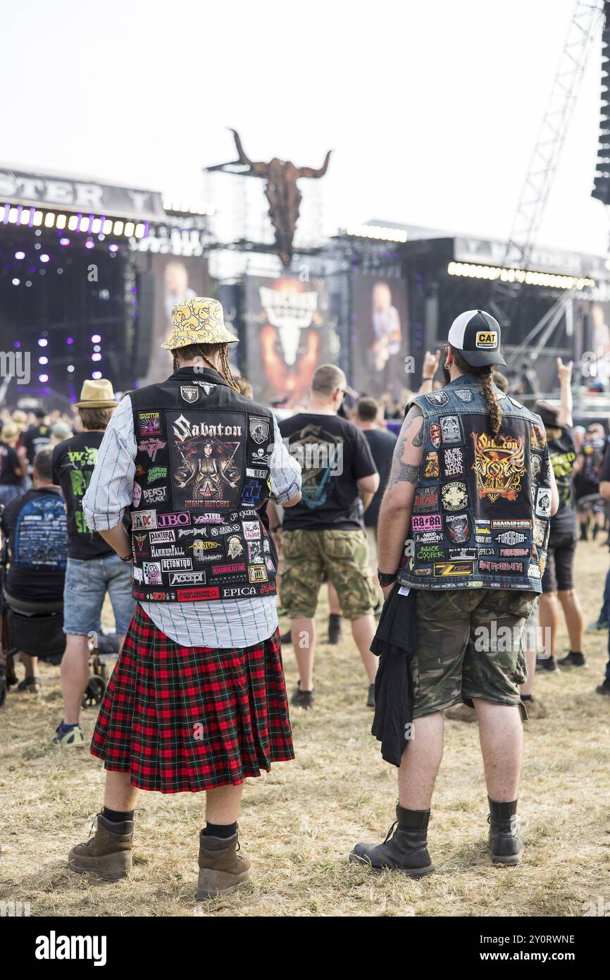 Metalheads with patches in front of the main stages at the Wacken Open ...