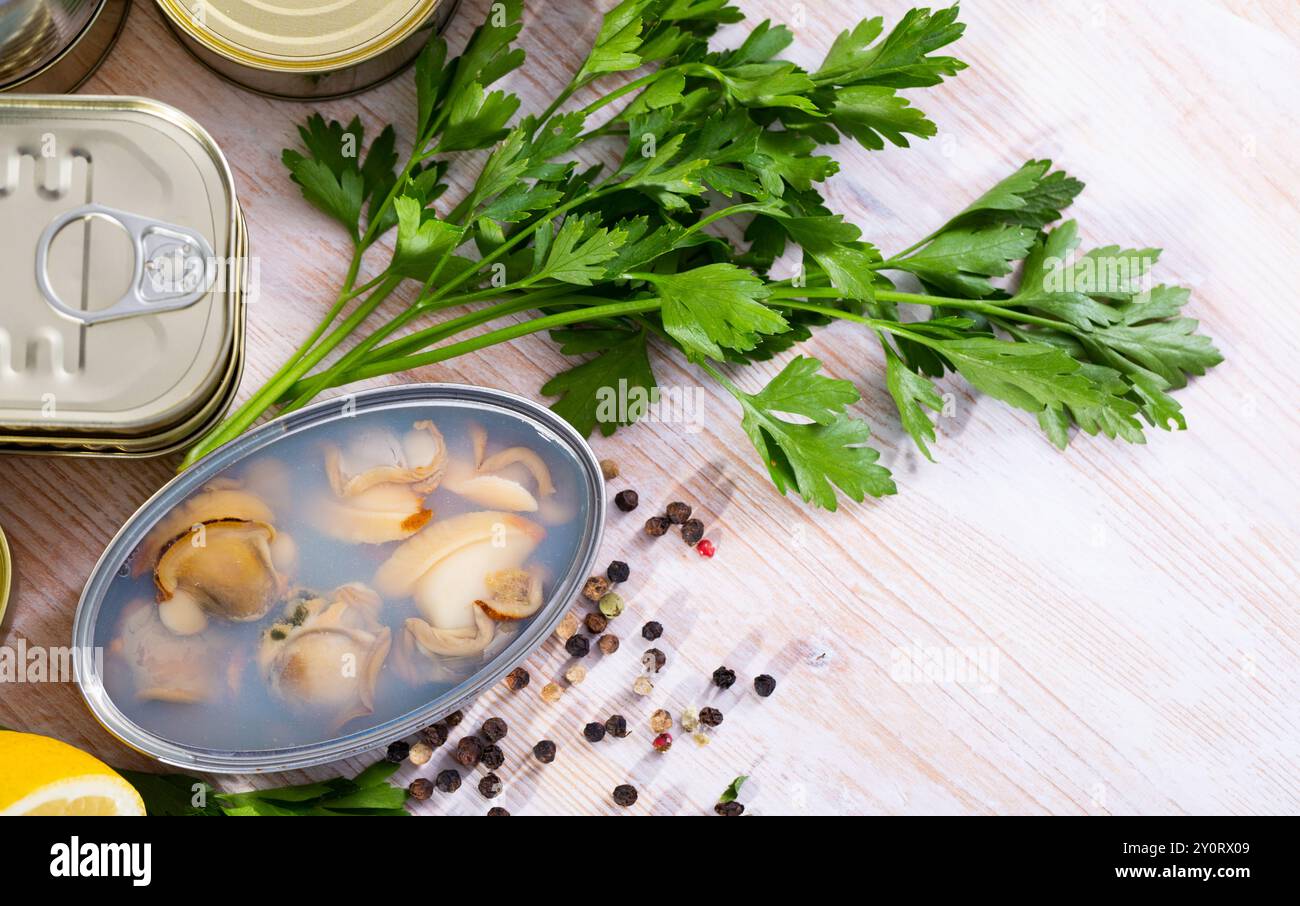 Canned seafood, whole shelled clams Stock Photo - Alamy