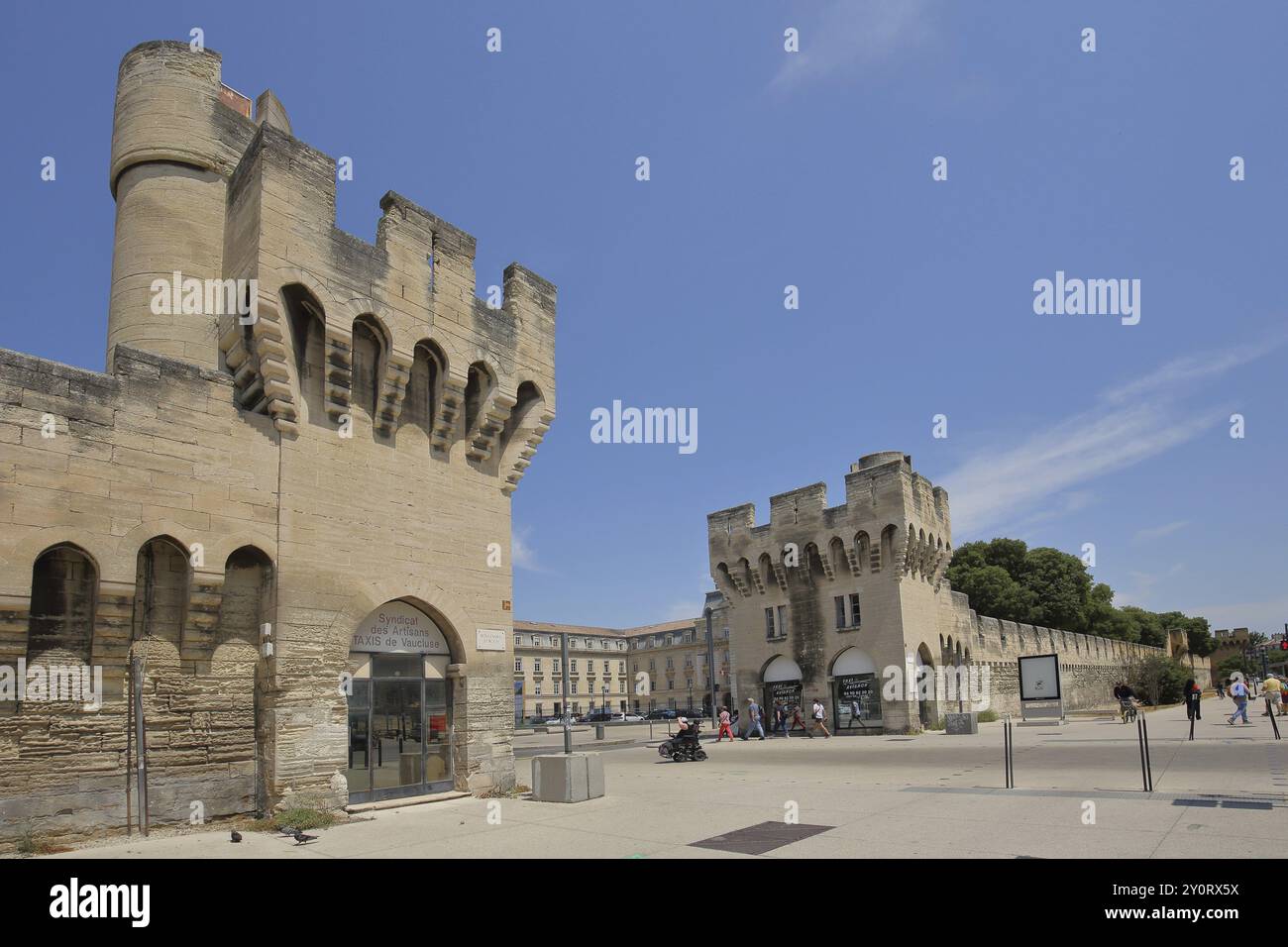 Historic city wall with defence towers and pedestrians, city ...