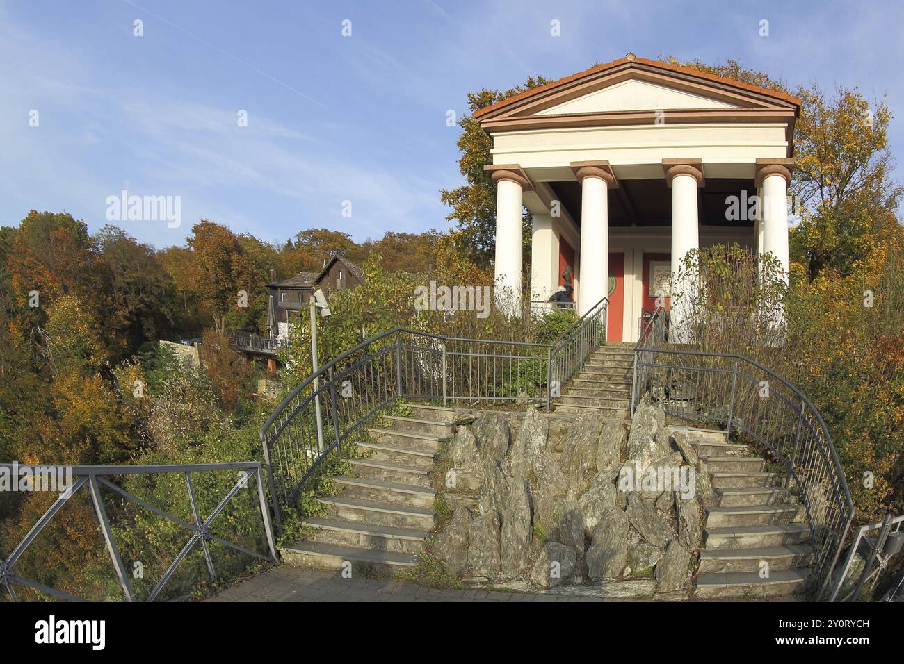 Classicist imperial temple with columns and staircase with rocks in ...