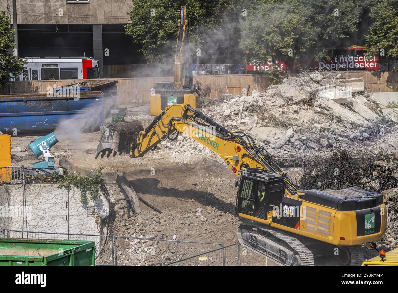 Water cannon, snow cannon, sprays water onto the construction site on ...