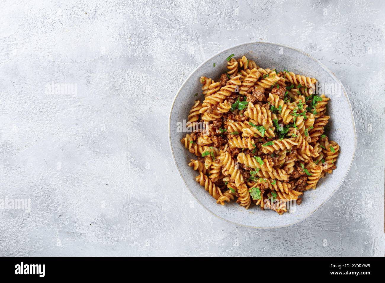Pasta in navy, pasta with minced meat, gray background, homemade ...