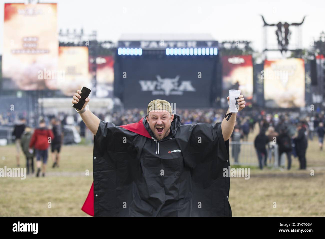 A festival visitor in front of the main stages at the Wacken Open Air ...