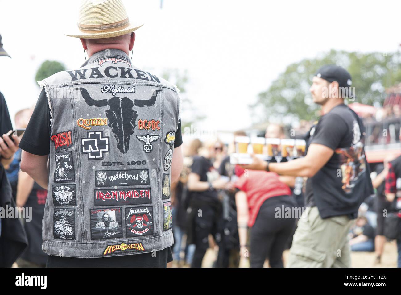 Visitors wearing Wacken waistcoats and beer at the Wacken Open Air in ...