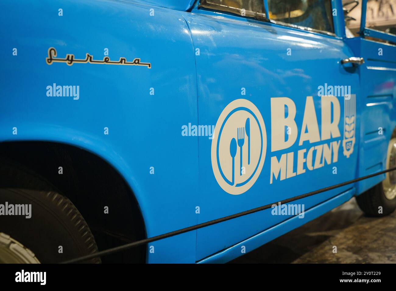 Blue Syrena Car with Bar Mleczny Logo. High quality photoA classic blue ...
