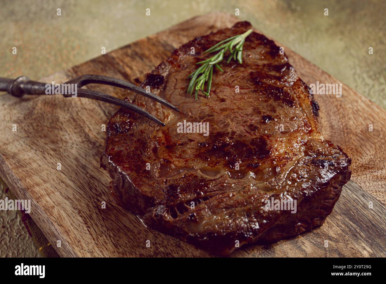Grilled steak, beef steak, rib eye steak, on a chopping board, top view ...