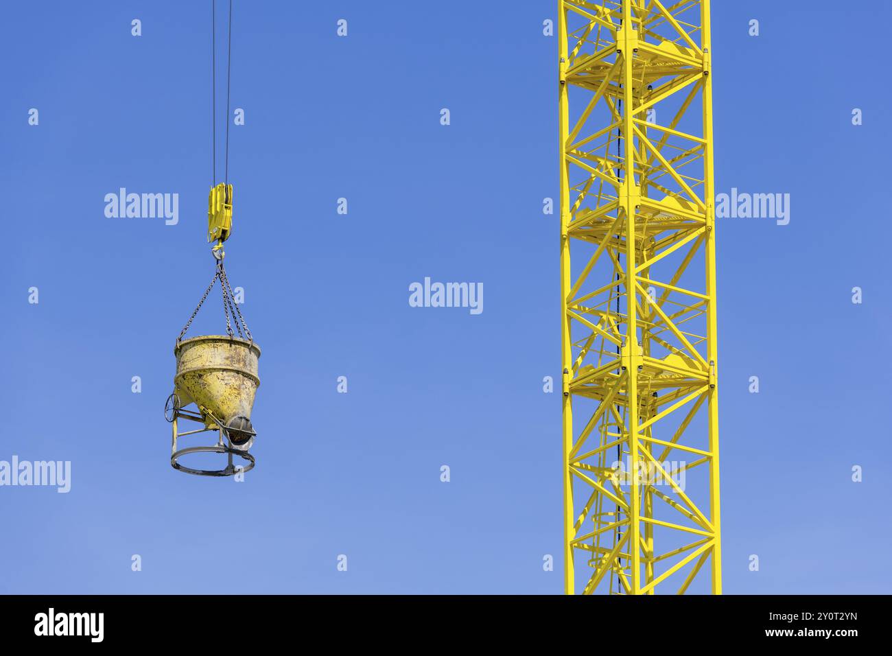 Construction crane with concrete bucket, concrete silo, crane bucket ...