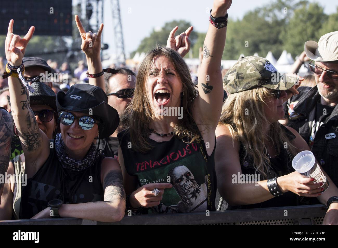 Metalheads in the front row at the Wacken Open Air in Wacken. The ...