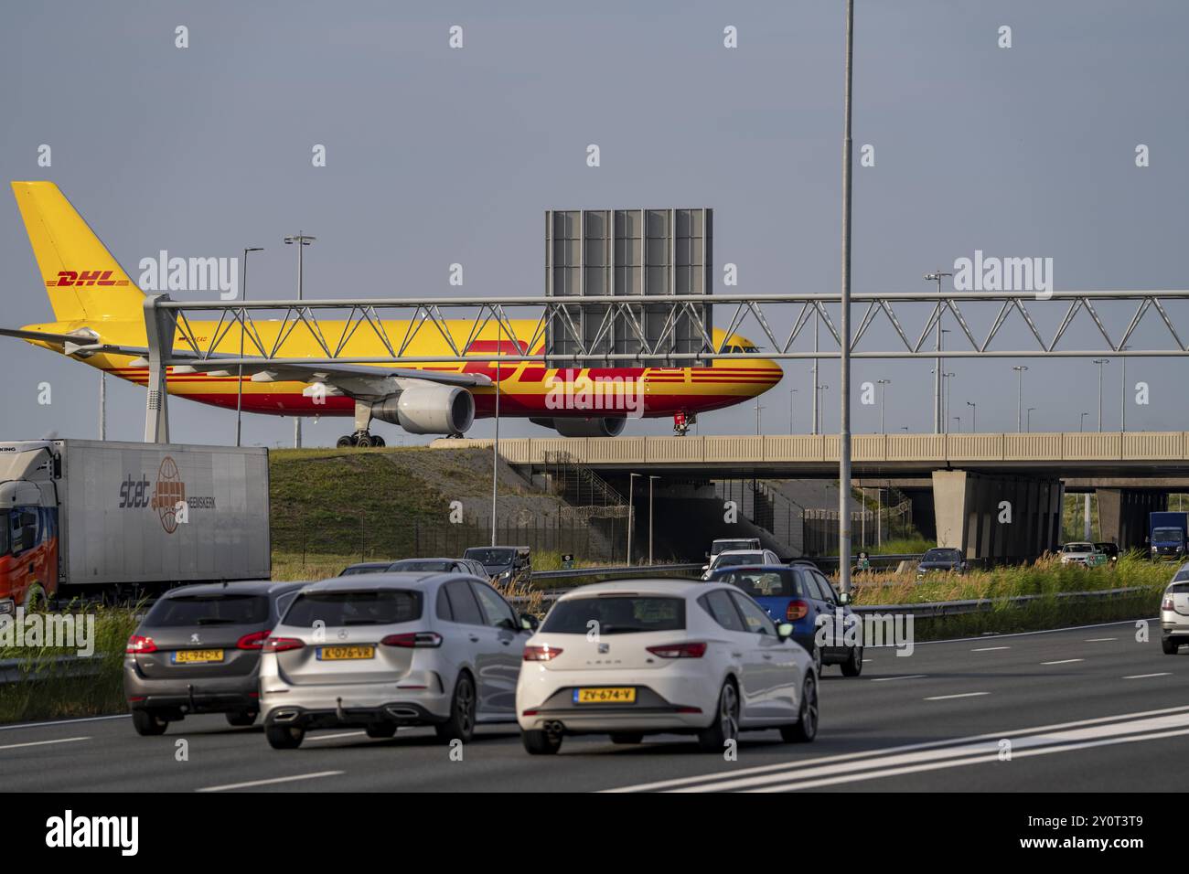 Amsterdam Schiphol Airport, DHL Cargo aircraft on the taxiway, bridge ...