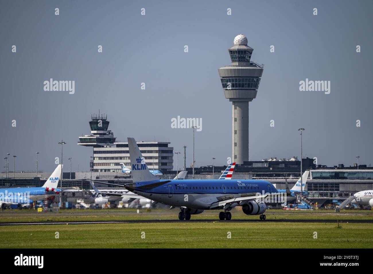 KLM Embraer E190STD aircraft landing at Amsterdam Schiphol Airport ...