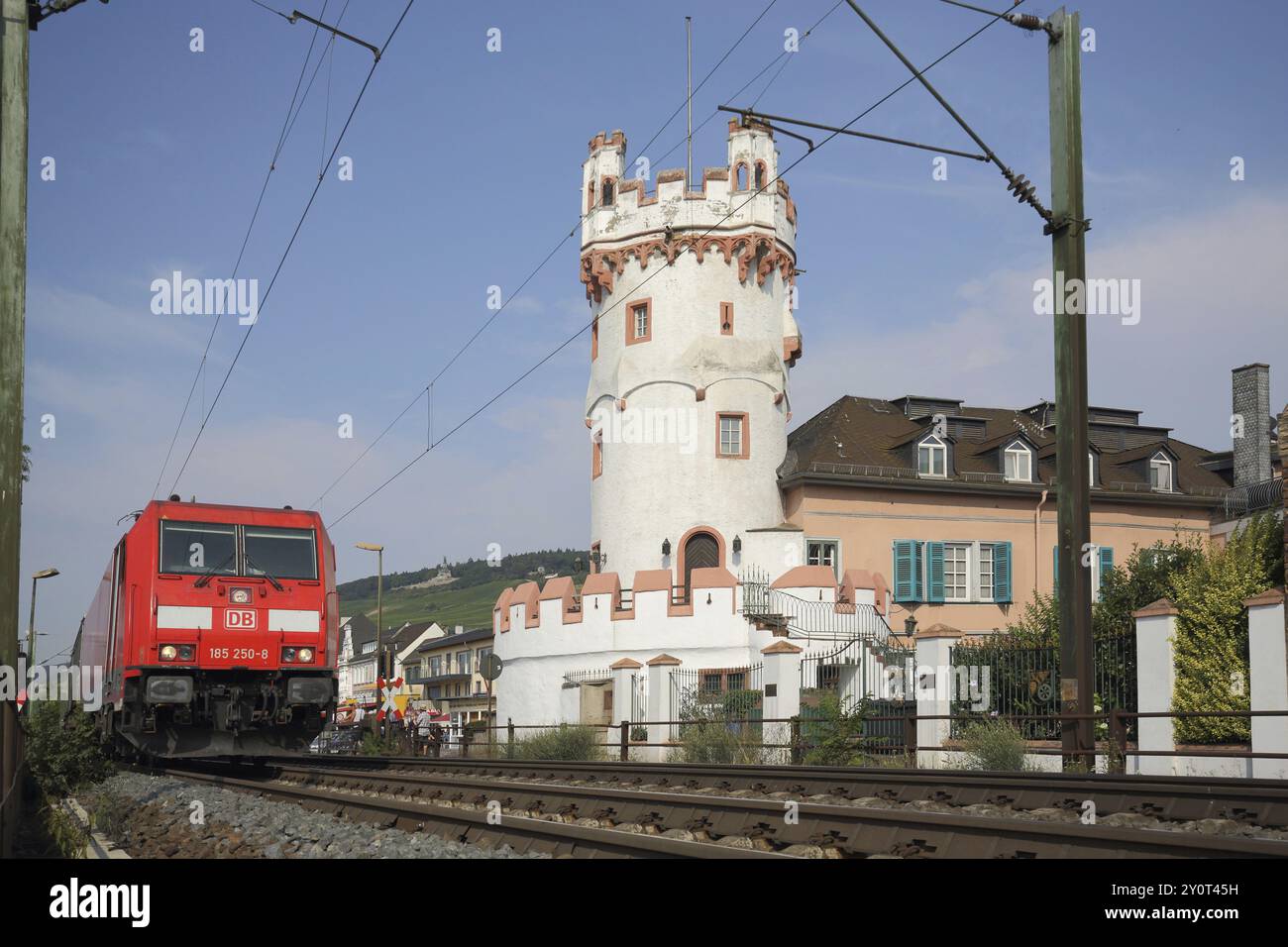 Gothic eagle tower with train with tracks, view from below, railway ...