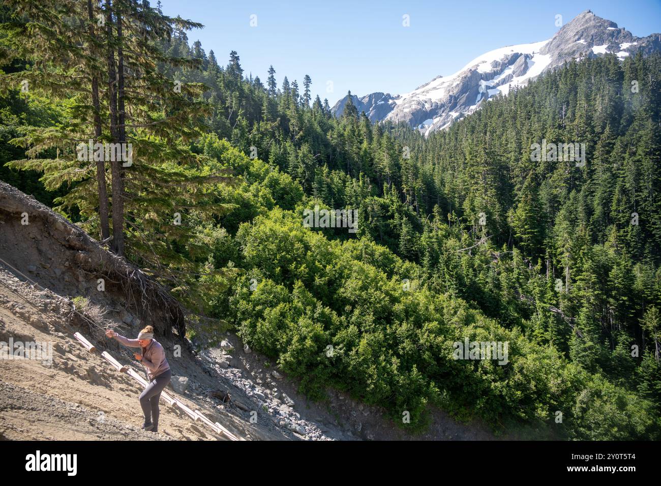 View of Mount Olympus with Woman Climbing up Rope Ladder on the way ...