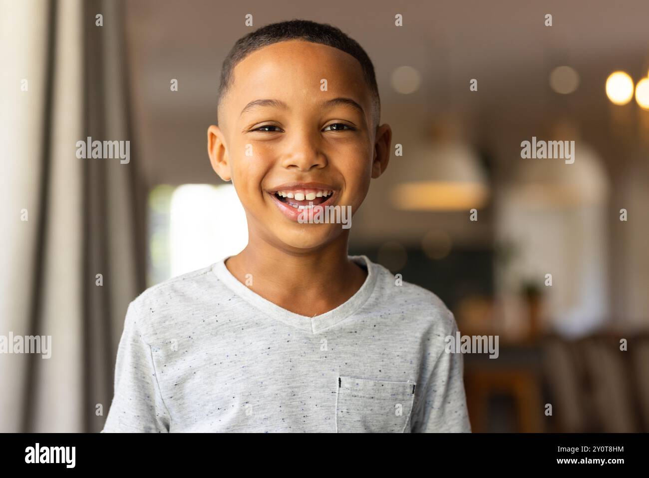 Boy standing looking camera in hi-res stock photography and images - Alamy