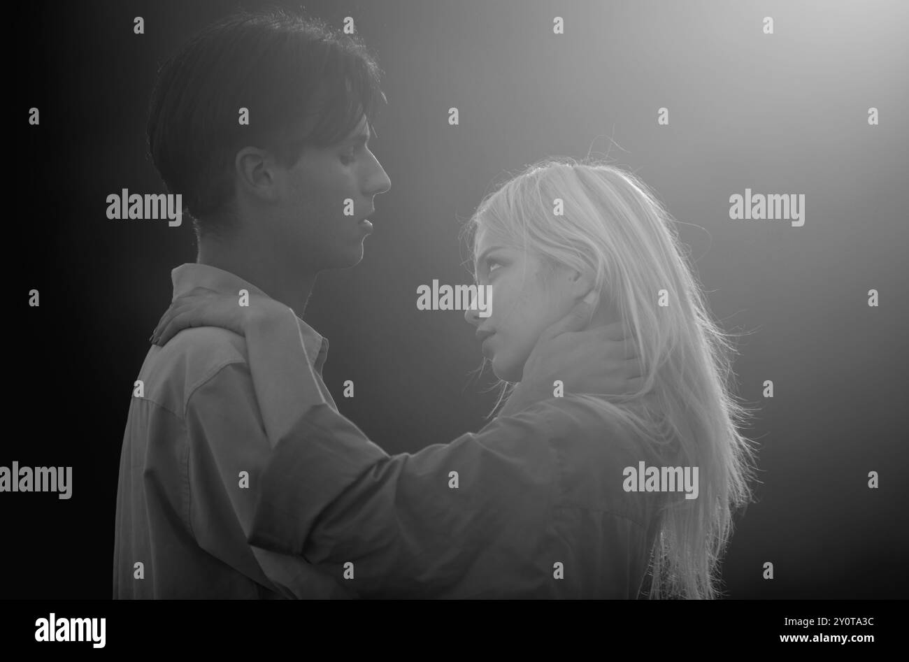 Sensual lovers hugging and kissing at sunset. Young couple in love hug each other. Love story ...