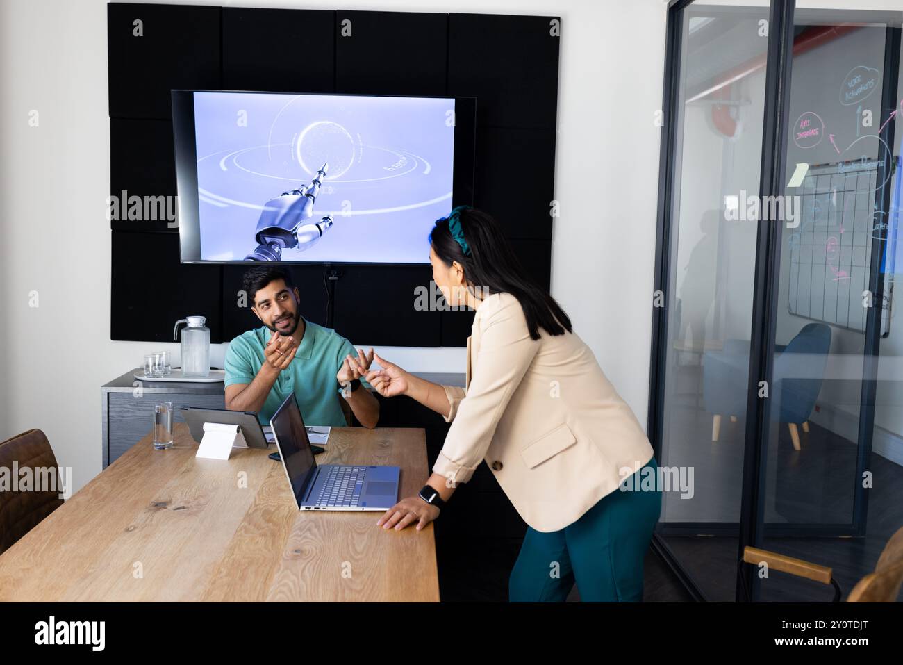 Discussing robotic technology, colleagues collaborating in modern ...