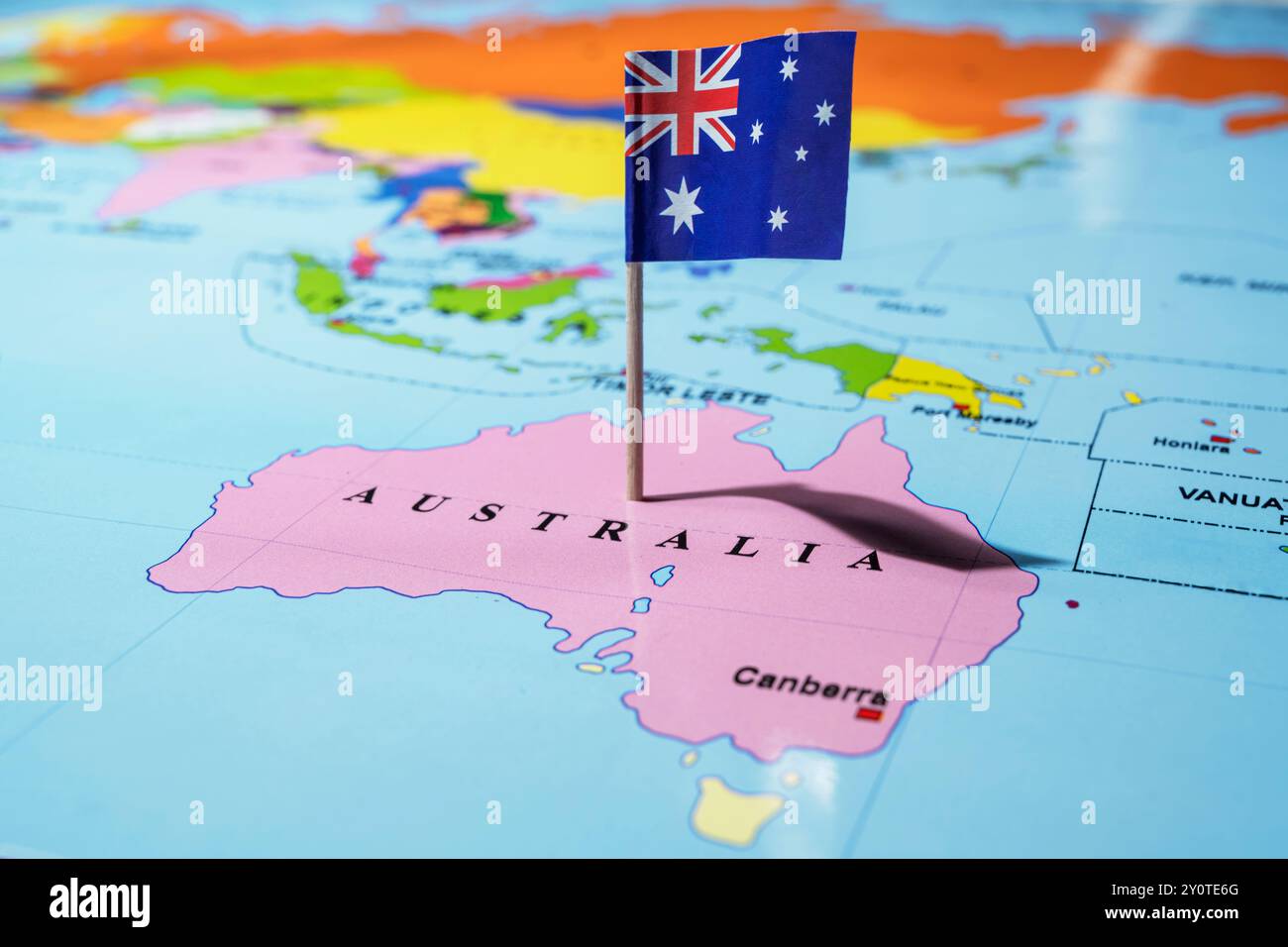 A map of Australia with an Australian flag on it. The flag is blue with ...