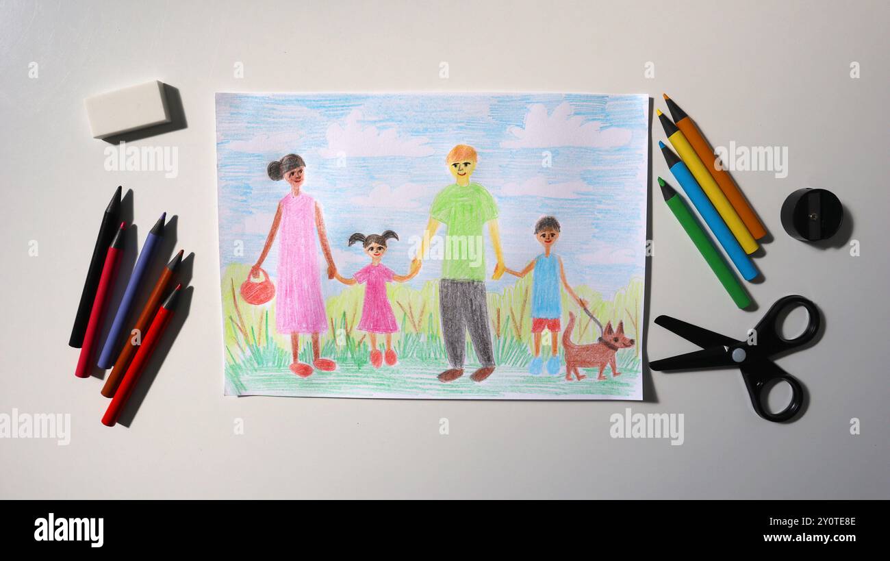 Photo of child's drawing with pencils. Picture shows family. Mom, dad ...
