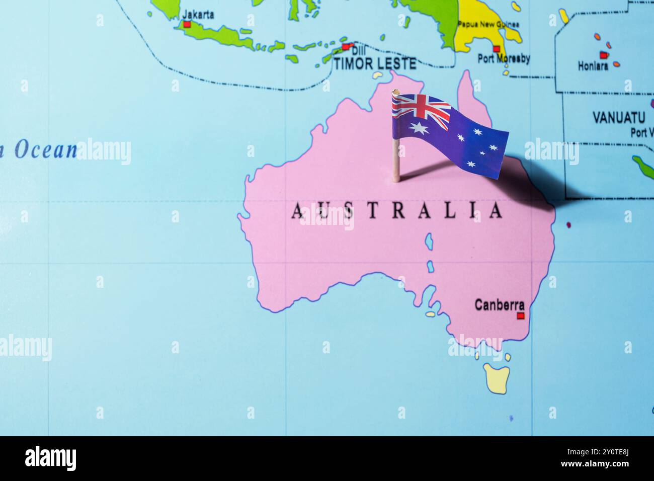 A map of Australia with an Australian flag on it. The flag is blue with ...