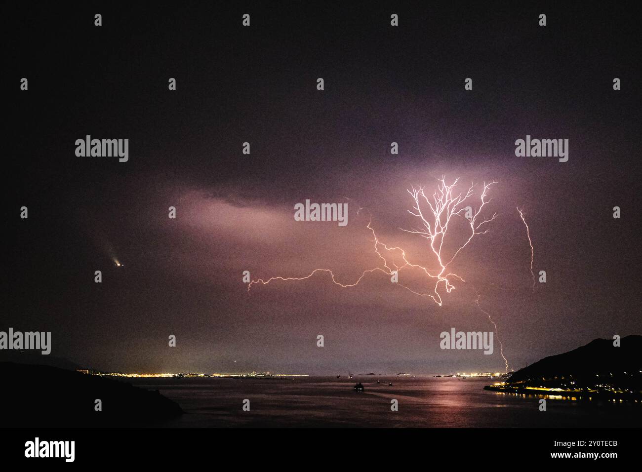 Hong Kong, China. 4th Sep, 2024. A lightning strikes across the night ...
