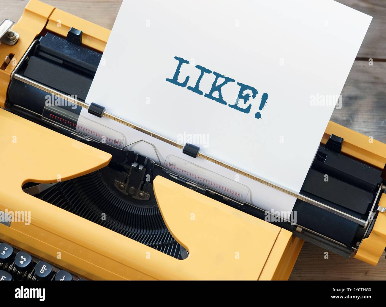 Vintage yellow typewriter with a LIKE note represents classic writing ...