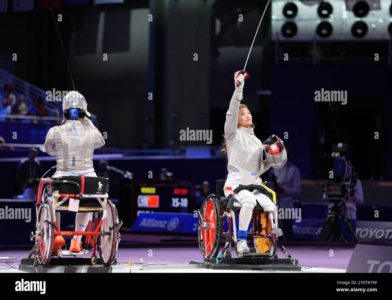 Paris, France. 3rd Sep, 2024. Gu Haiyan (R) of China celebrates after ...