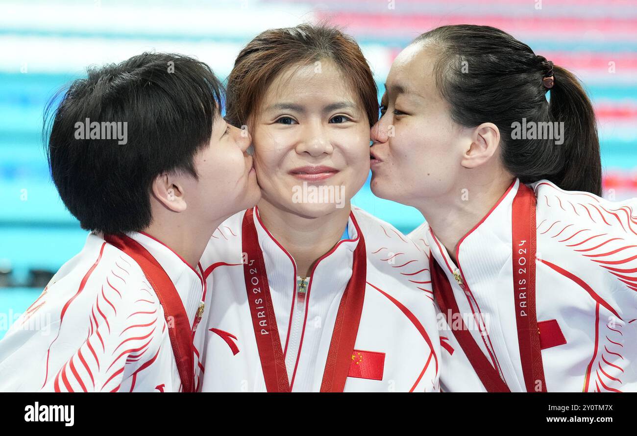 Paris, France. 3rd Sep, 2024. China's Lu Dong (C), He Shenggao (L) and Liu Yu pose for photo ...