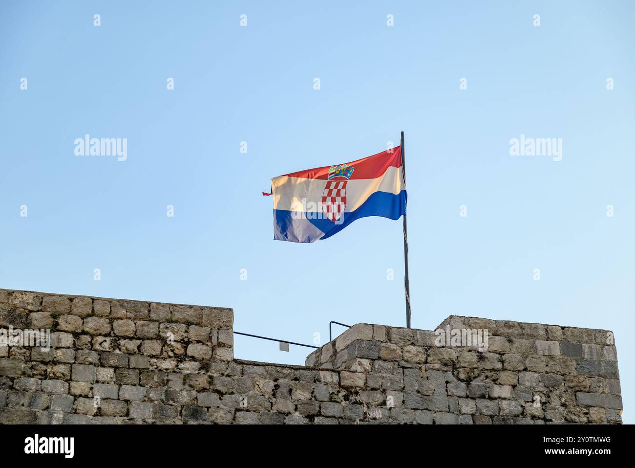 Flag of Croatia atop the medieval walls of the Old Walled City of ...