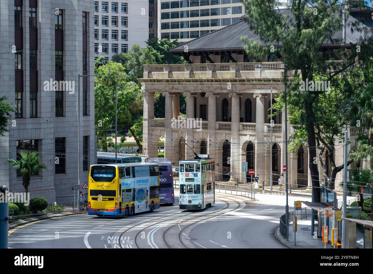 Hong Kong, China - July 03, 2024 : A double decker bus and a streetcar ...