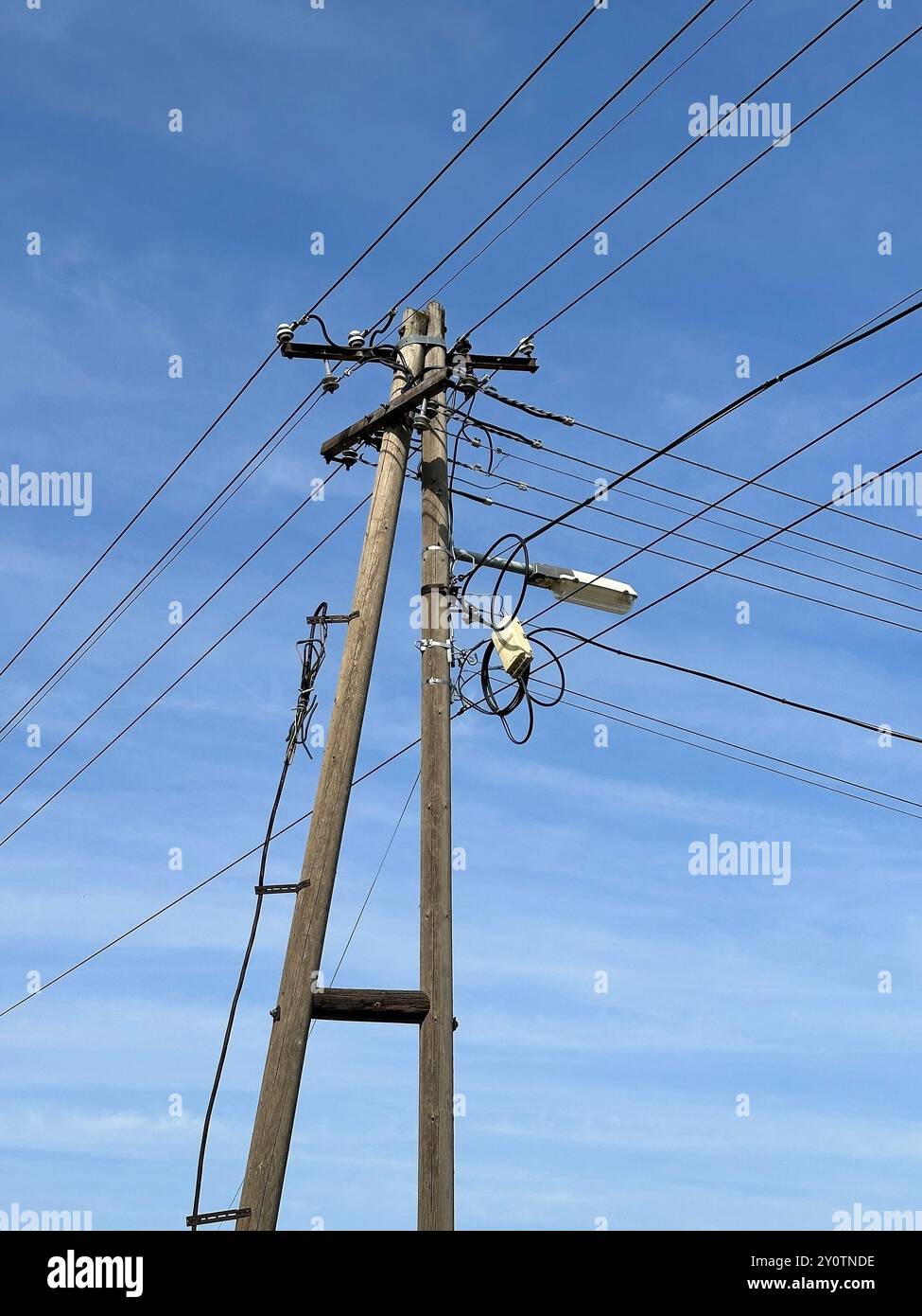 Electricity pylon on the city street Stock Photo - Alamy