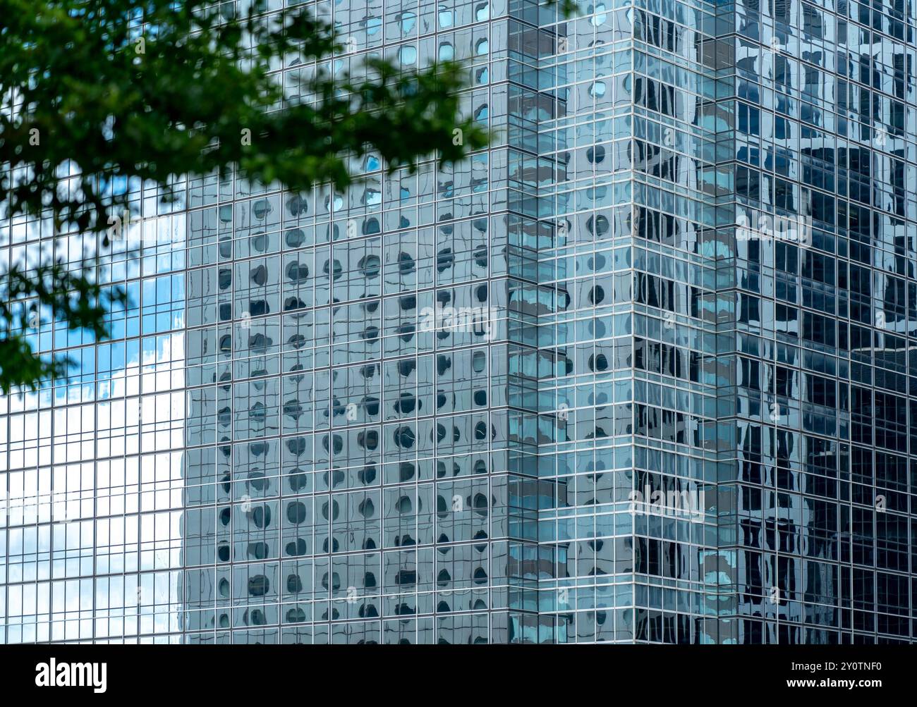 A modern skyscraper in Hong Kong, China, with a grid of windows ...