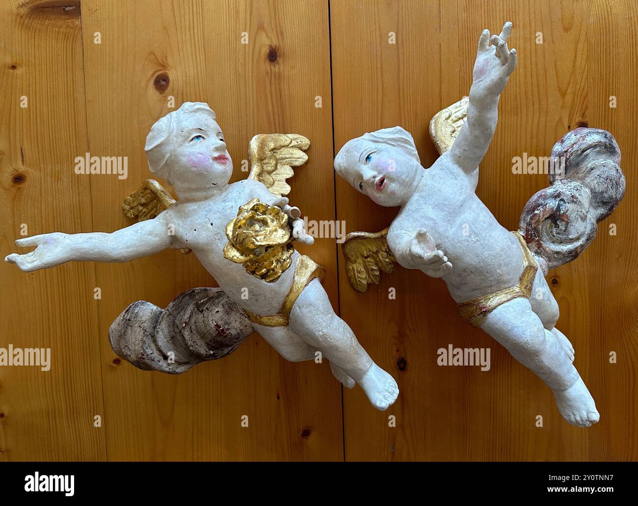 Angel figurines on the wooden floor Stock Photo - Alamy