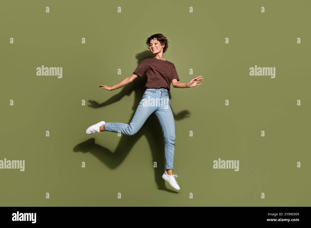 Full size photo of pretty young girl elegant running jump shopping ...