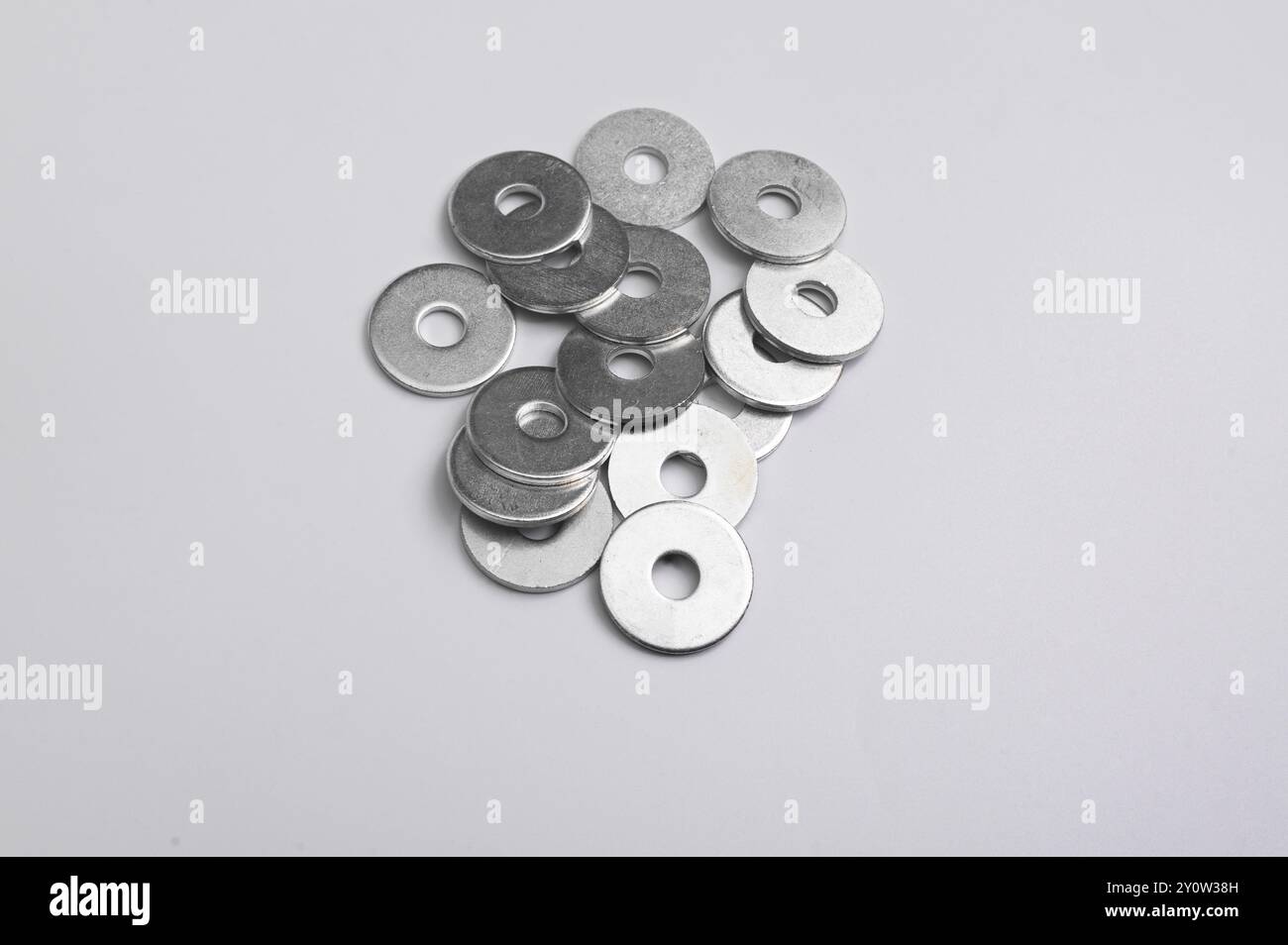 metal washers on a white background. close-up Stock Photo - Alamy