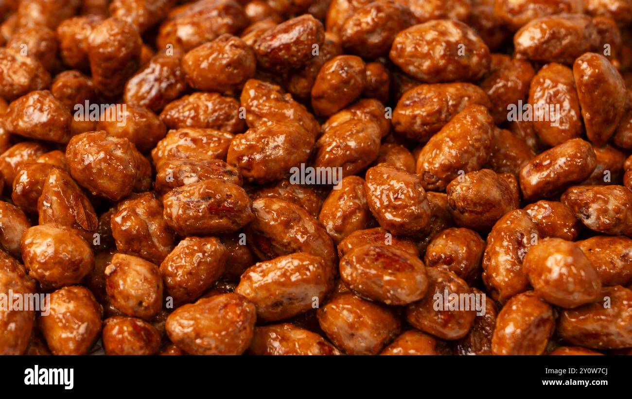 Tasty sweet roasted peanuts as a background Stock Photo - Alamy