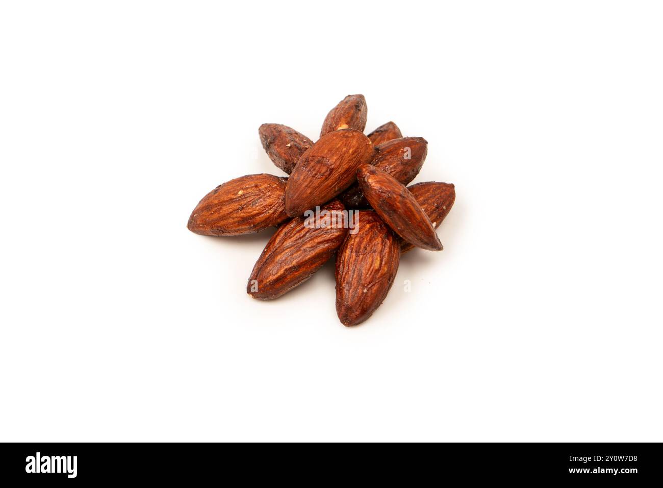 A group of caramelized almonds isolated on a white background Stock ...