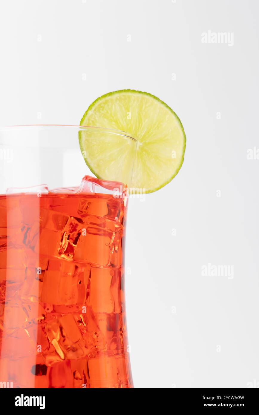 Vertical photo capturing a close-up of a red iced drink, adorned with a ...