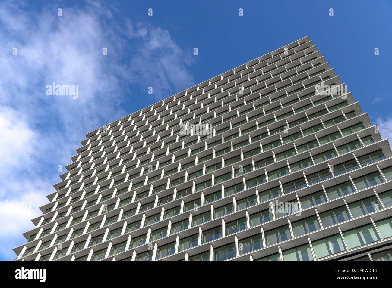 Modern office building facade with repeating geometric pattern in Tokyo ...
