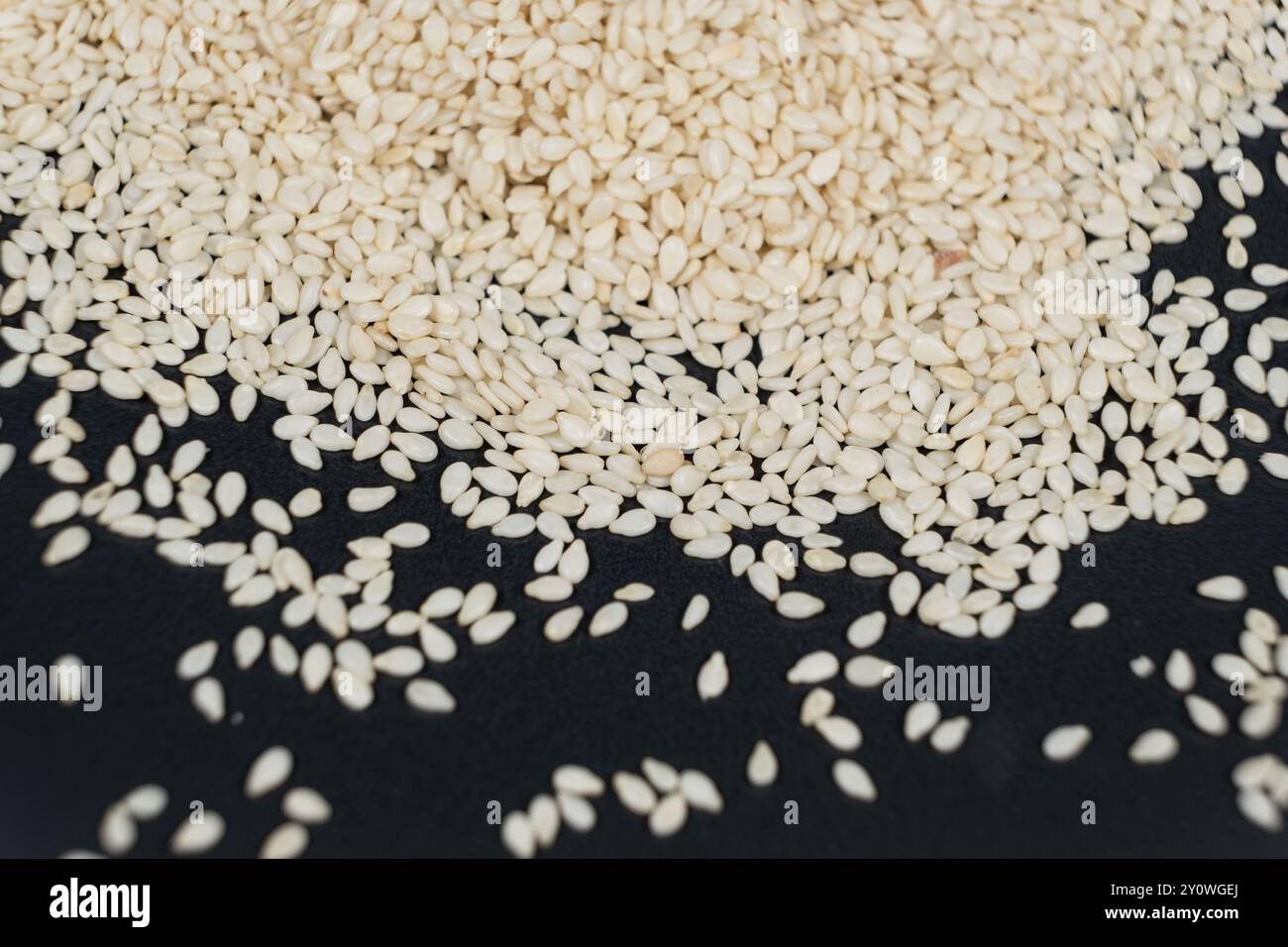 Macro kernels of white roasted sesame seeds Stock Photo - Alamy