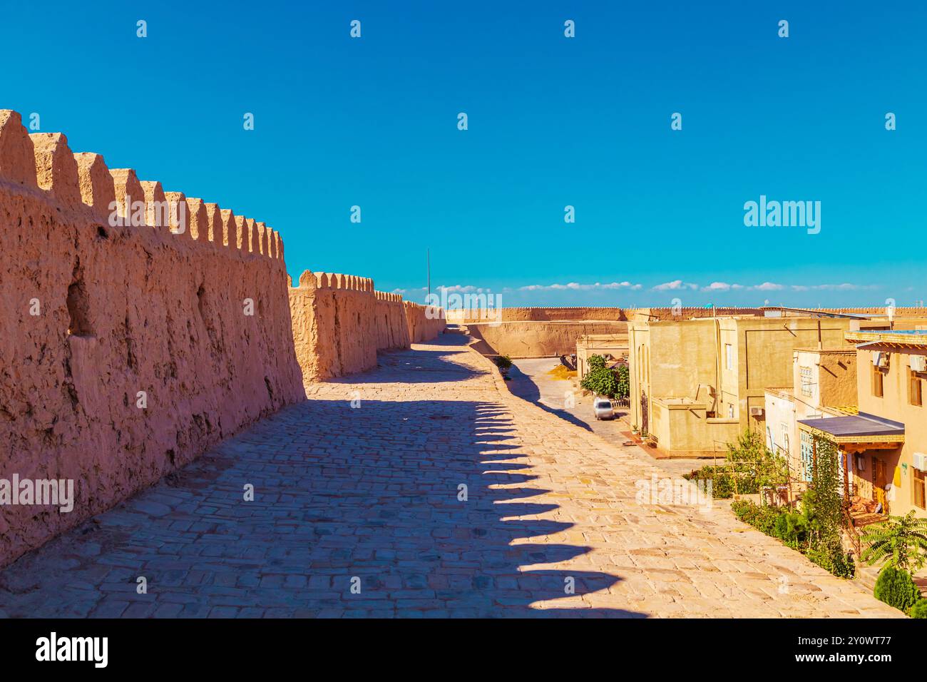 The city walls of the ancient city of Khiva at sunset. Khiva ...