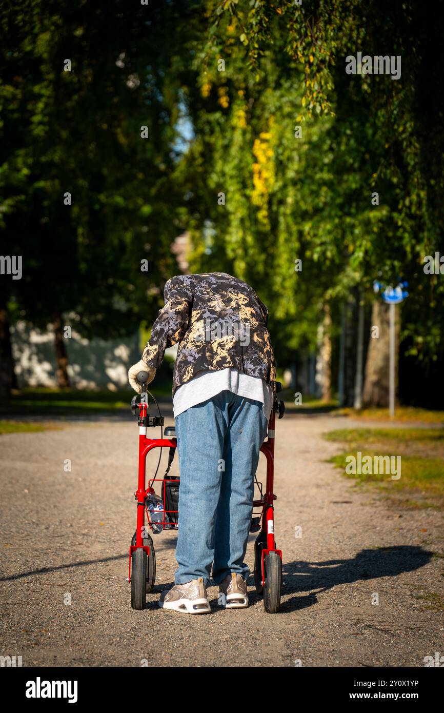 Woman walking with rollator hi-res stock photography and images - Alamy
