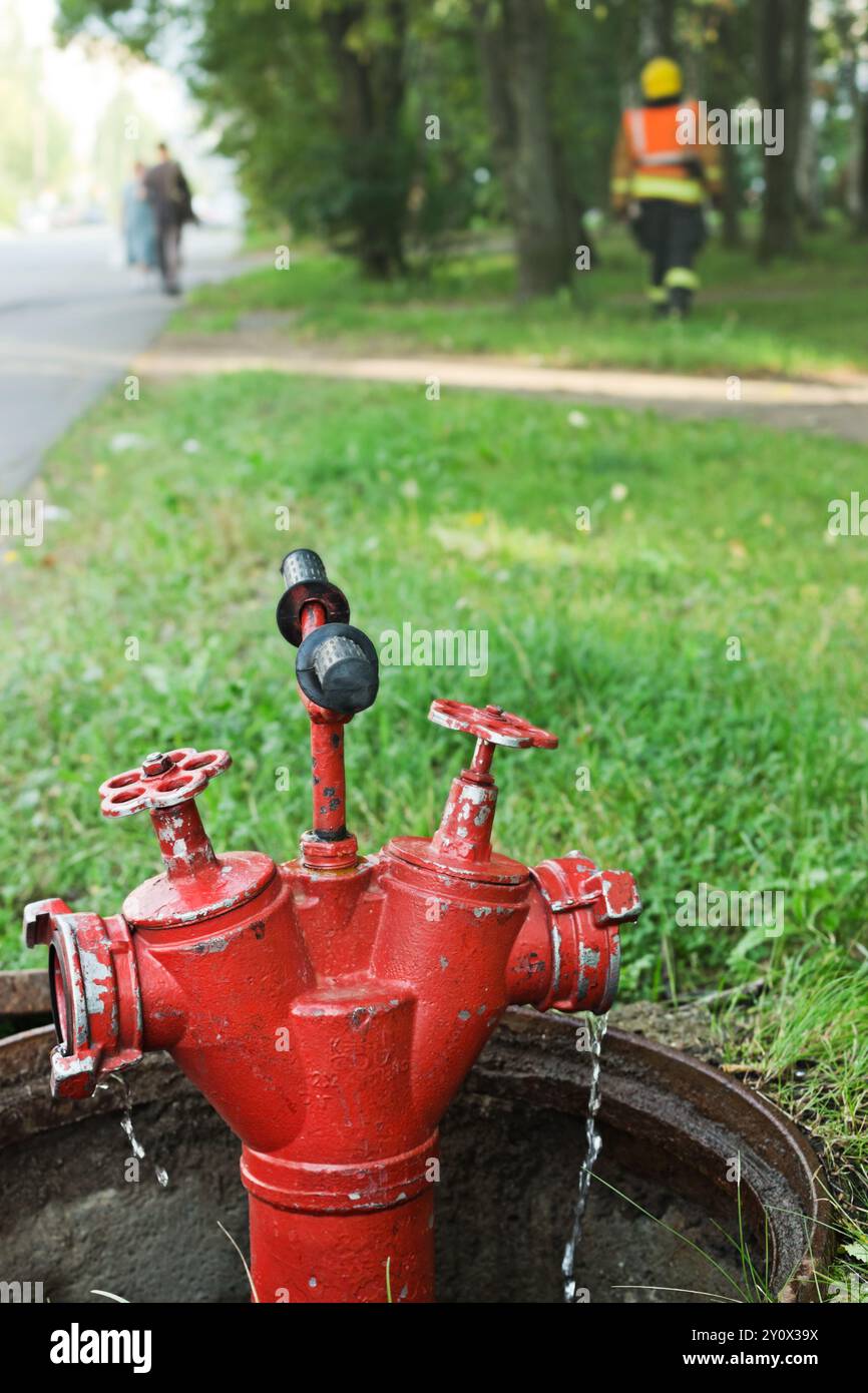 A fire hydrant is fixed on the street network of a water supply for ...