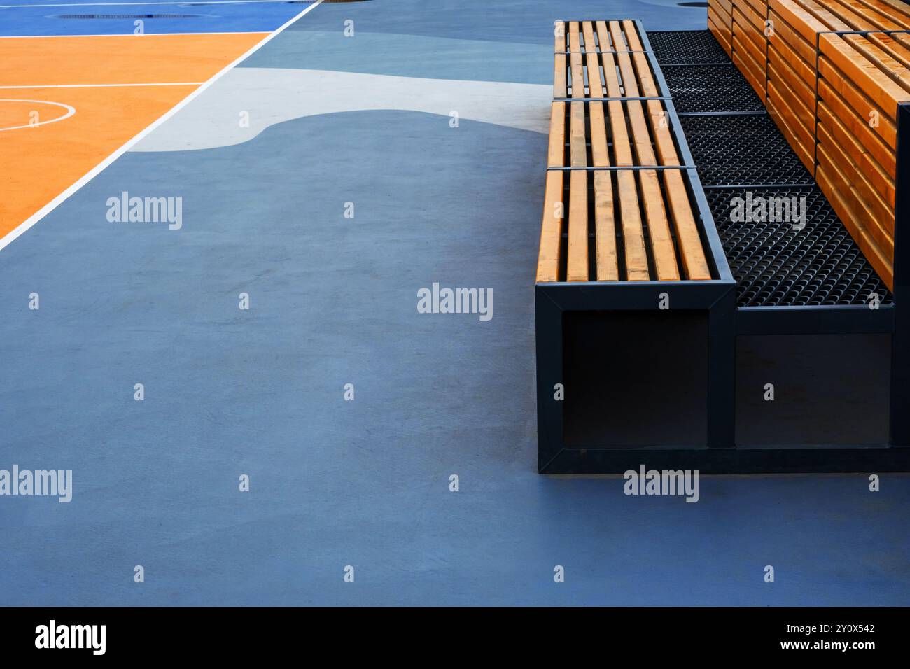 Modern wooden benches on the outdoor basketball court Stock Photo - Alamy