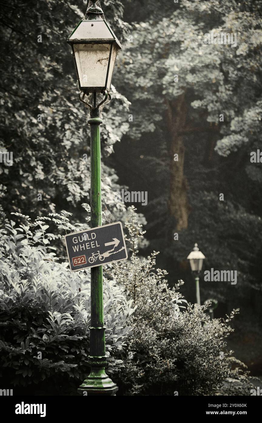 Direction sign fixed to Victorian style street lamp Stock Photo - Alamy