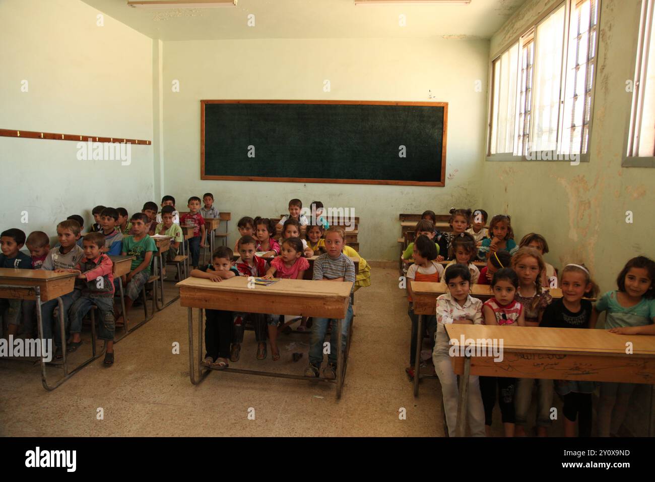 Children attending school. After no schooling for two years, some ...