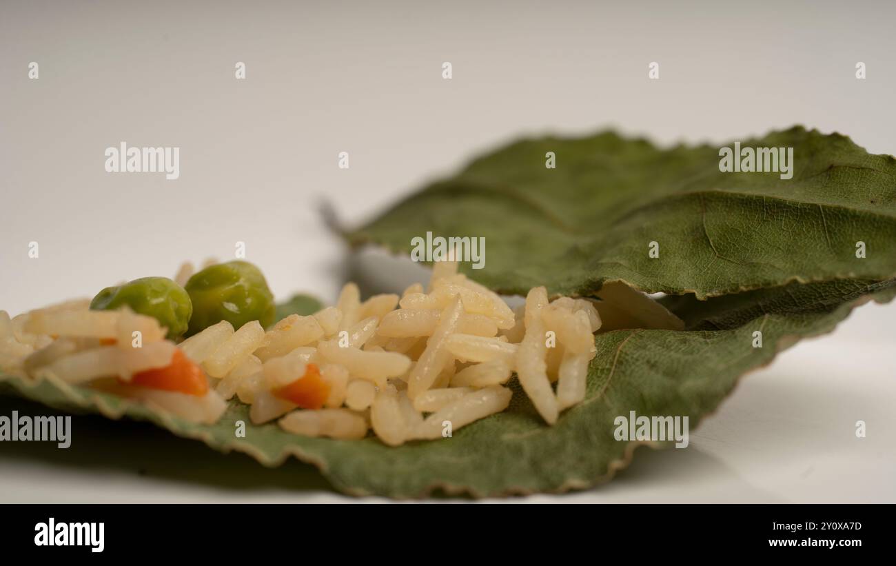 EXCLUSIVE RICE DISH THREE DELIGHTS ON A LEAF SHOWN IN AN ELEGANT AND ...