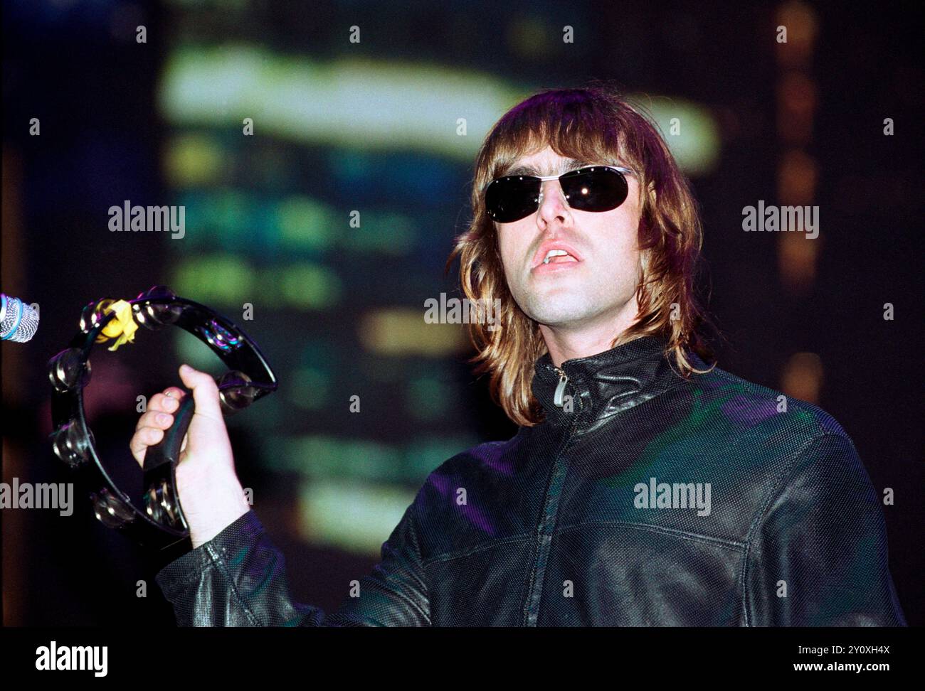 OASIS vocalist and frontman Liam Gallagher performing at Reading Festival 25th Aug 2000 ...